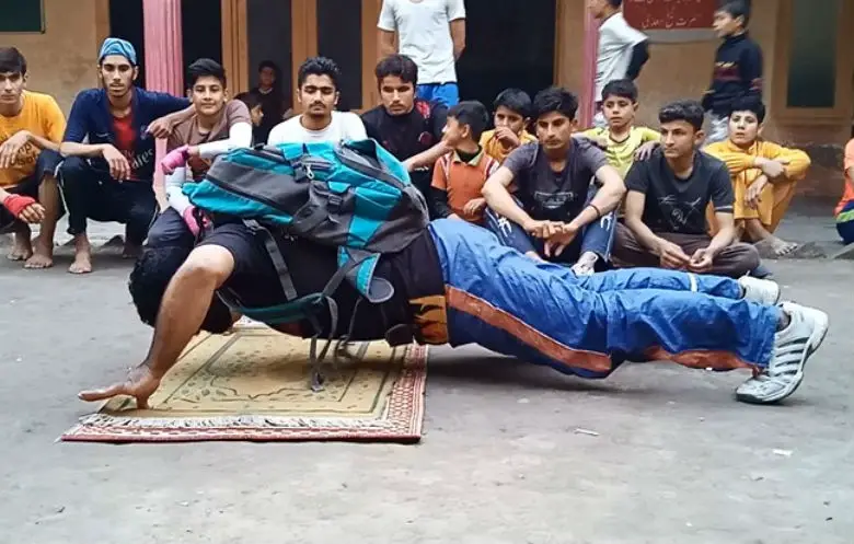 Most two finger push ups carrying a 40 lb pack in one minute (male ...