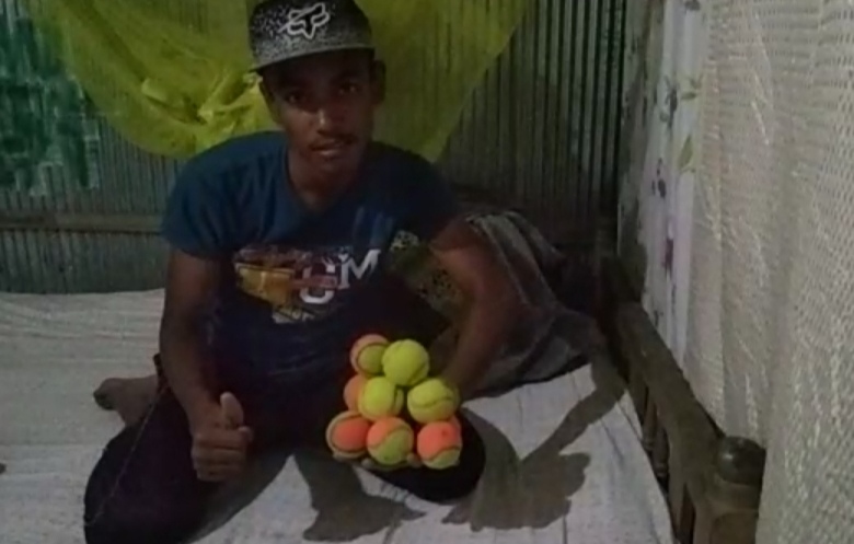 Most tennis balls balanced on the back of the hand | Guinness World Records