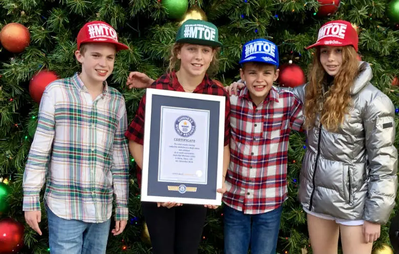 Most couples kissing under the mistletoe for a charity event | Guinness ...