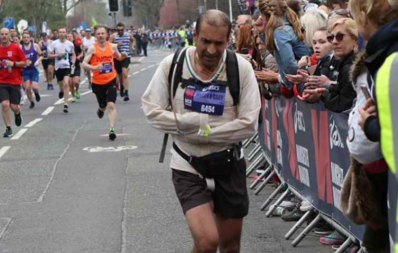 Fastest marathon in a straitjacket (male) | Guinness World Records